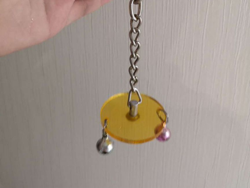 Игрушка для попугая