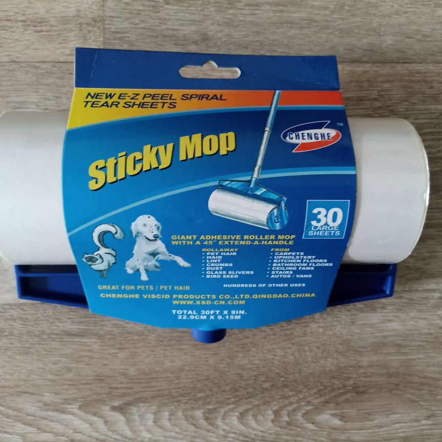 Липкий ролик для чистки одежды